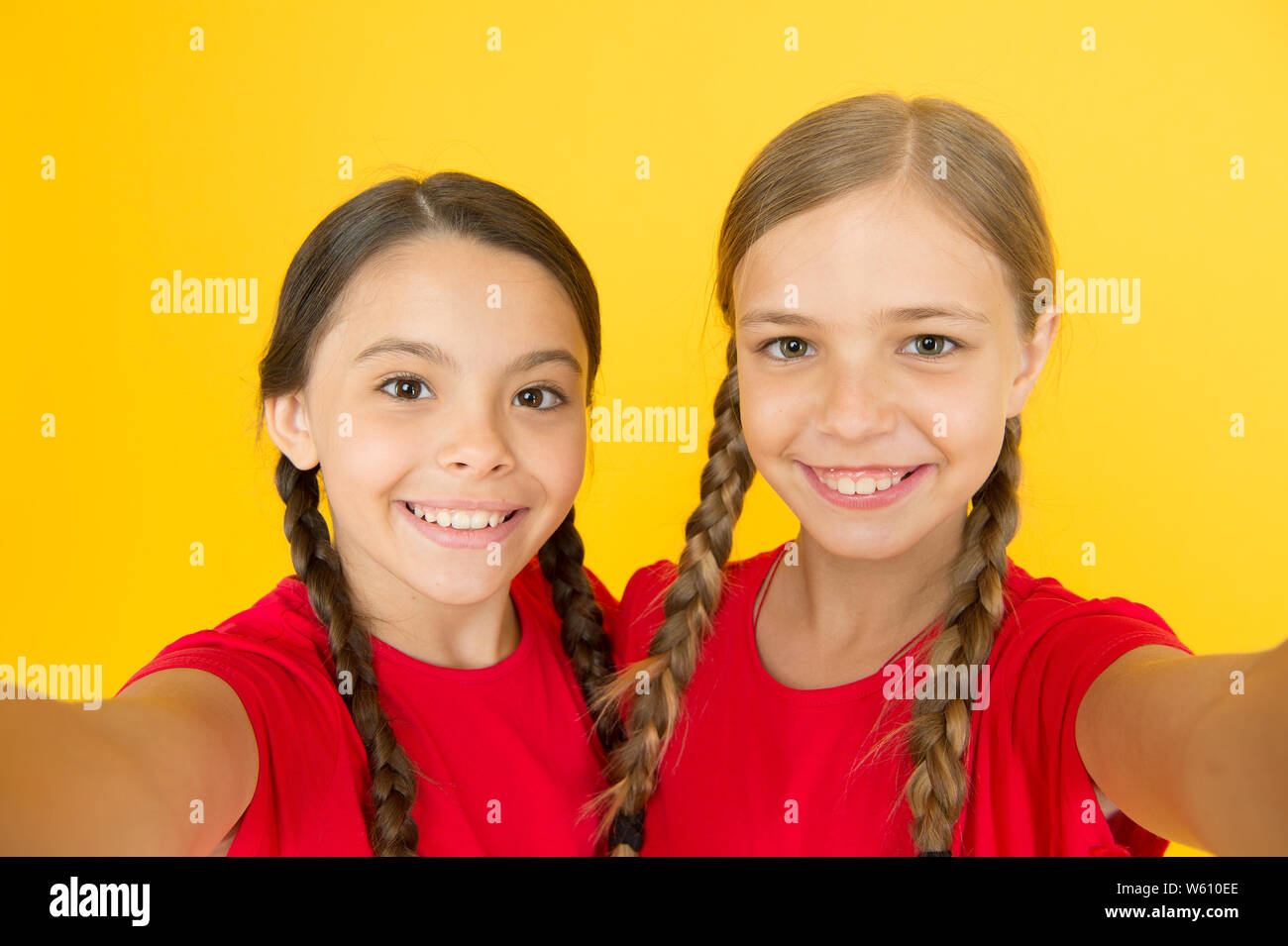 real heppiness. selfie girls. small girls make selfie on phone. having ...