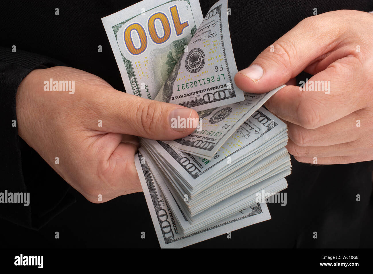 Businessman holding US dollar banknote money on white background Stock ...