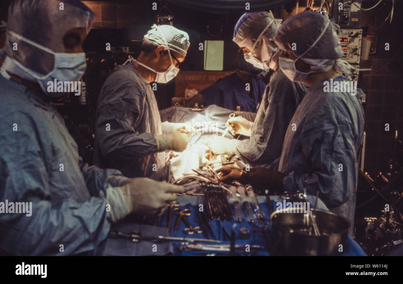 Surgen operating on opening heart surgery on bypass Stock Photo - Alamy