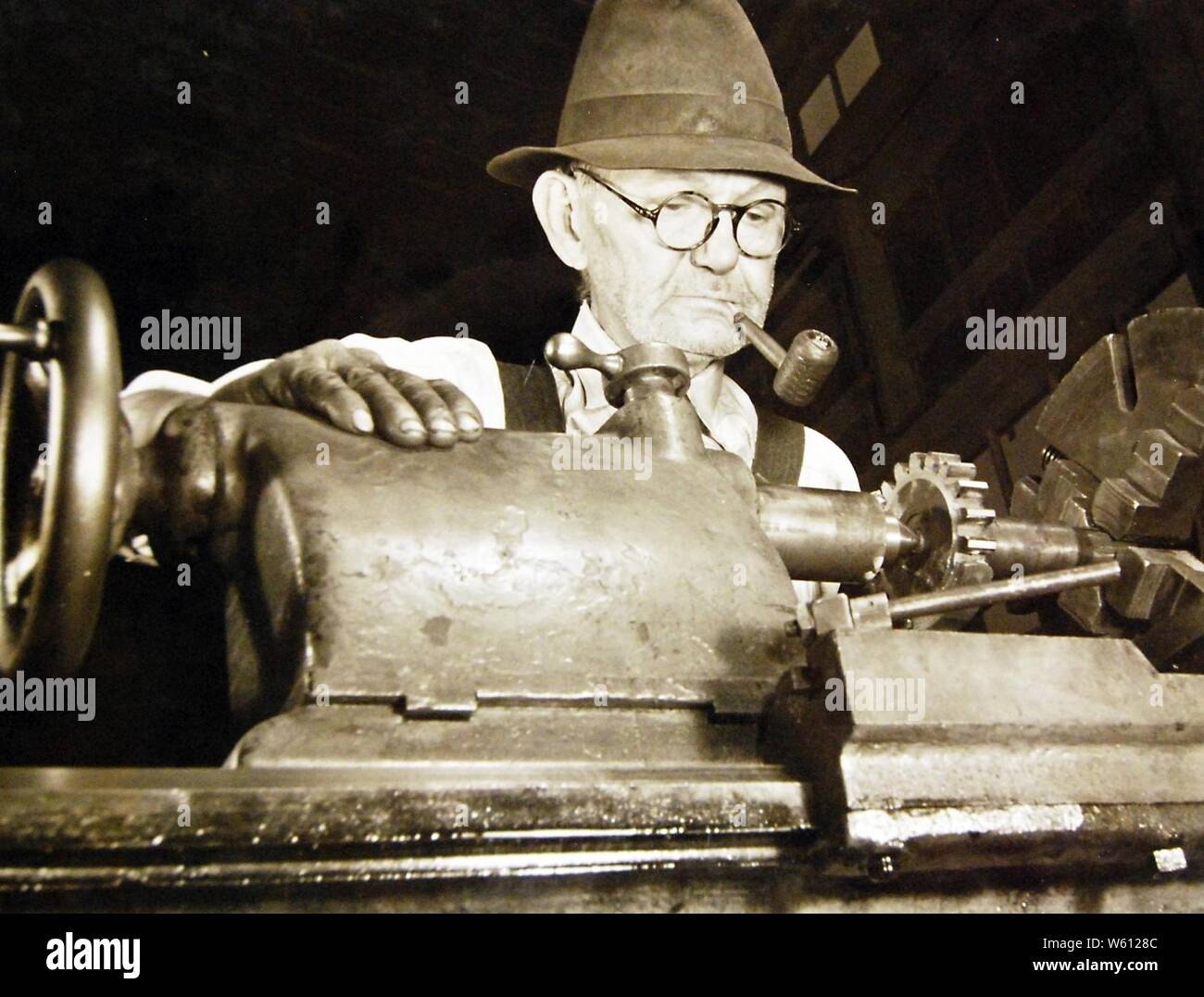 David Zimbough operating a lathe to make parts for sweepers ...