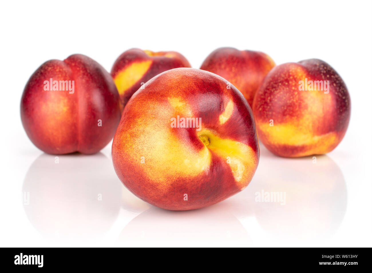 Group of five whole fresh red nectarine isolated on white background ...