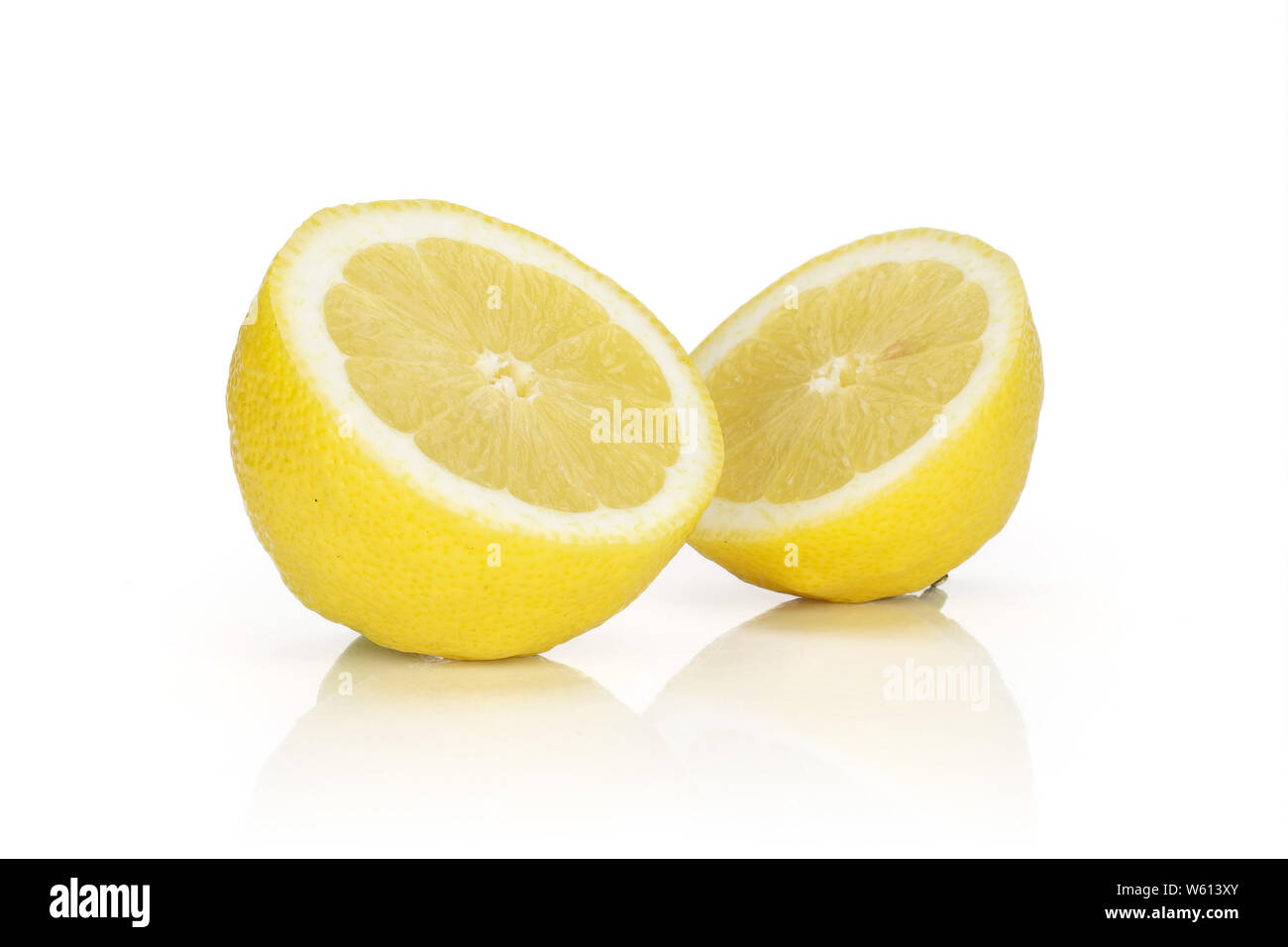 Group of two halves of fresh yellow lemon isolated on white background ...