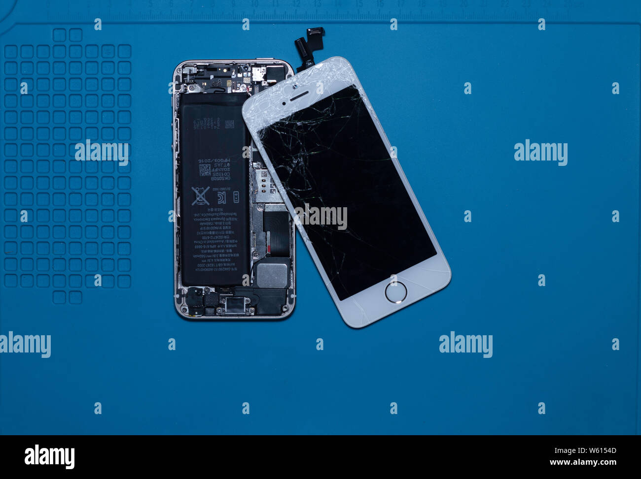 phone with the damaged screen, ready to be repaired by the specialist ...