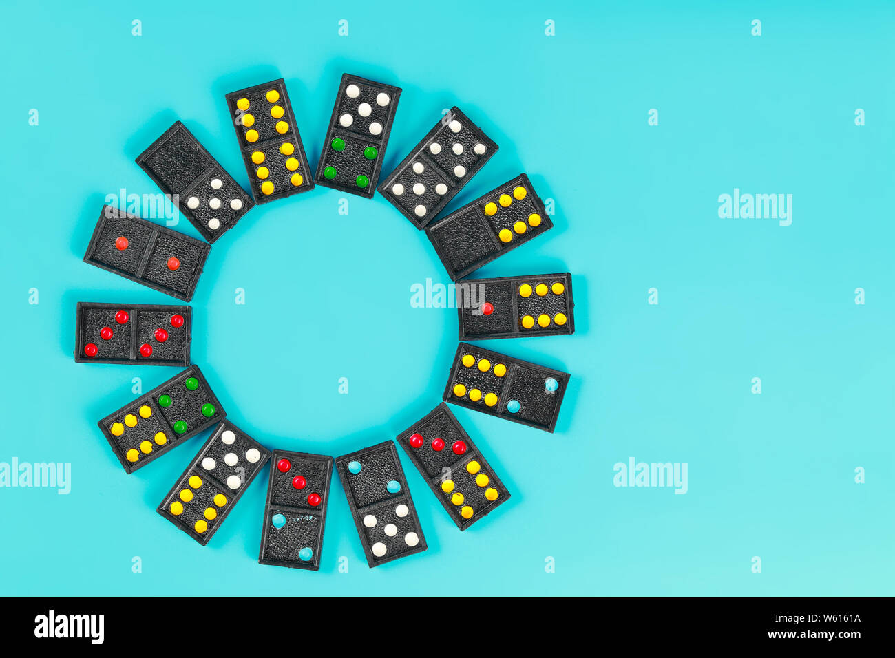 circle of domino on blue background Stock Photo - Alamy
