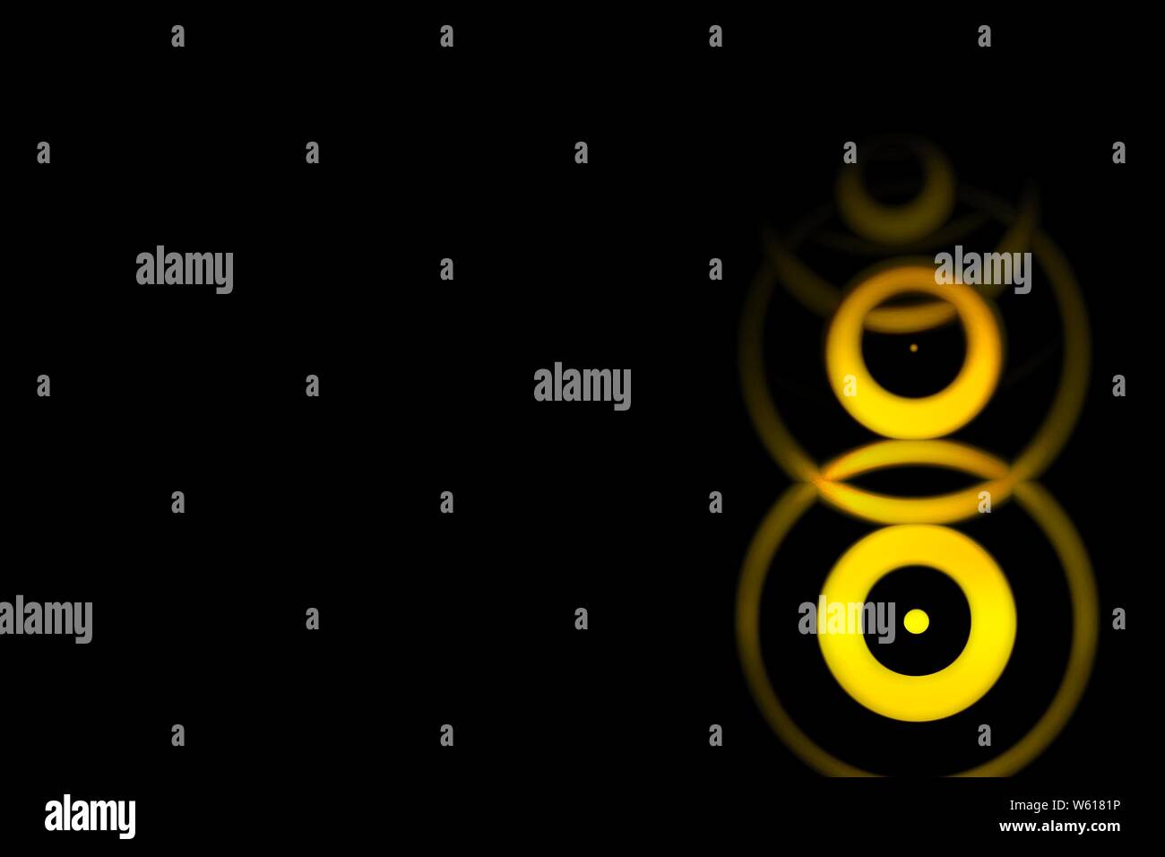 Abstract yellow sound waves oscillating with circle ring on black ...