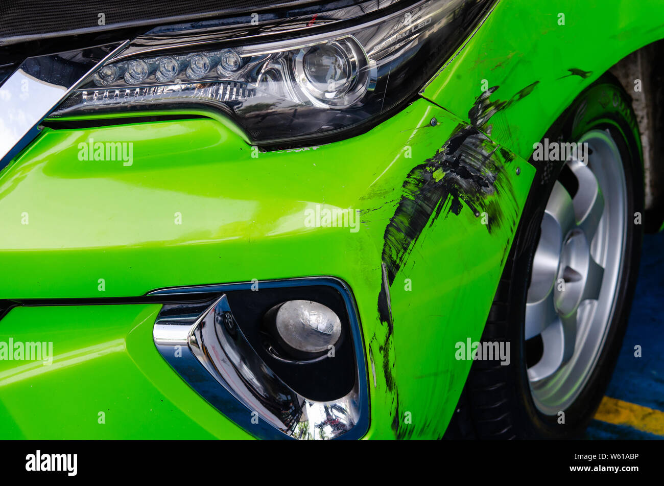green car bump marks on the front bumper Stock Photo - Alamy