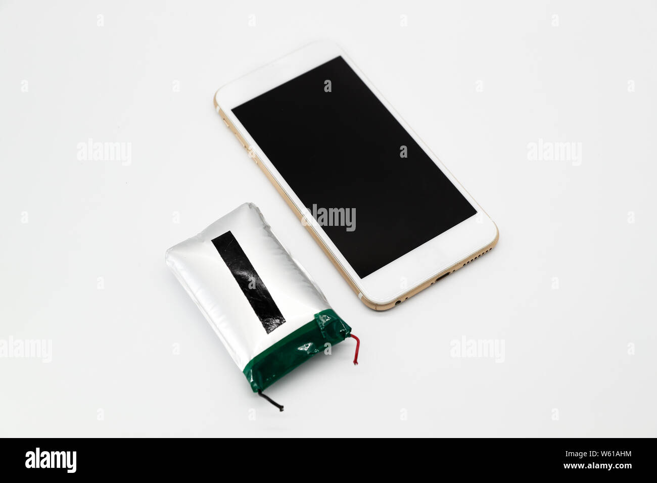 broken power bank with smart phone isolated and white background Stock ...