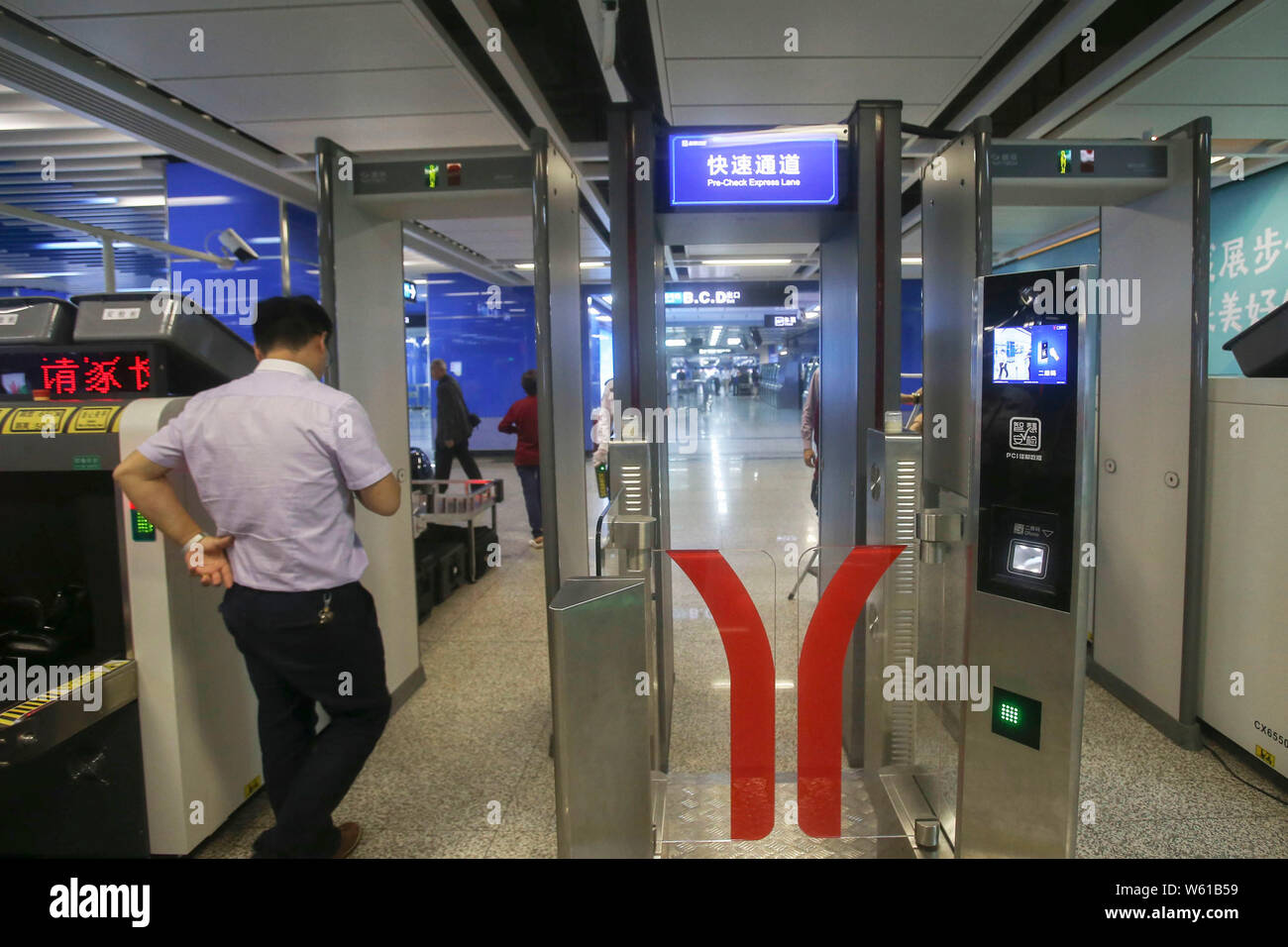 A passenger has his face scanned by a face recognition system to buy ...