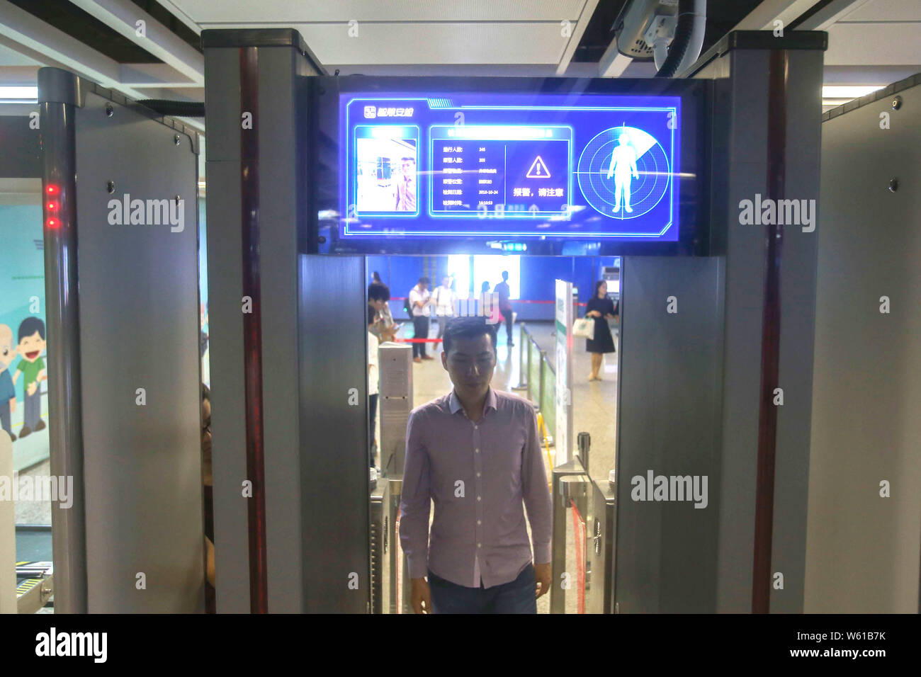 A passenger has his face scanned by a face recognition system to buy ...