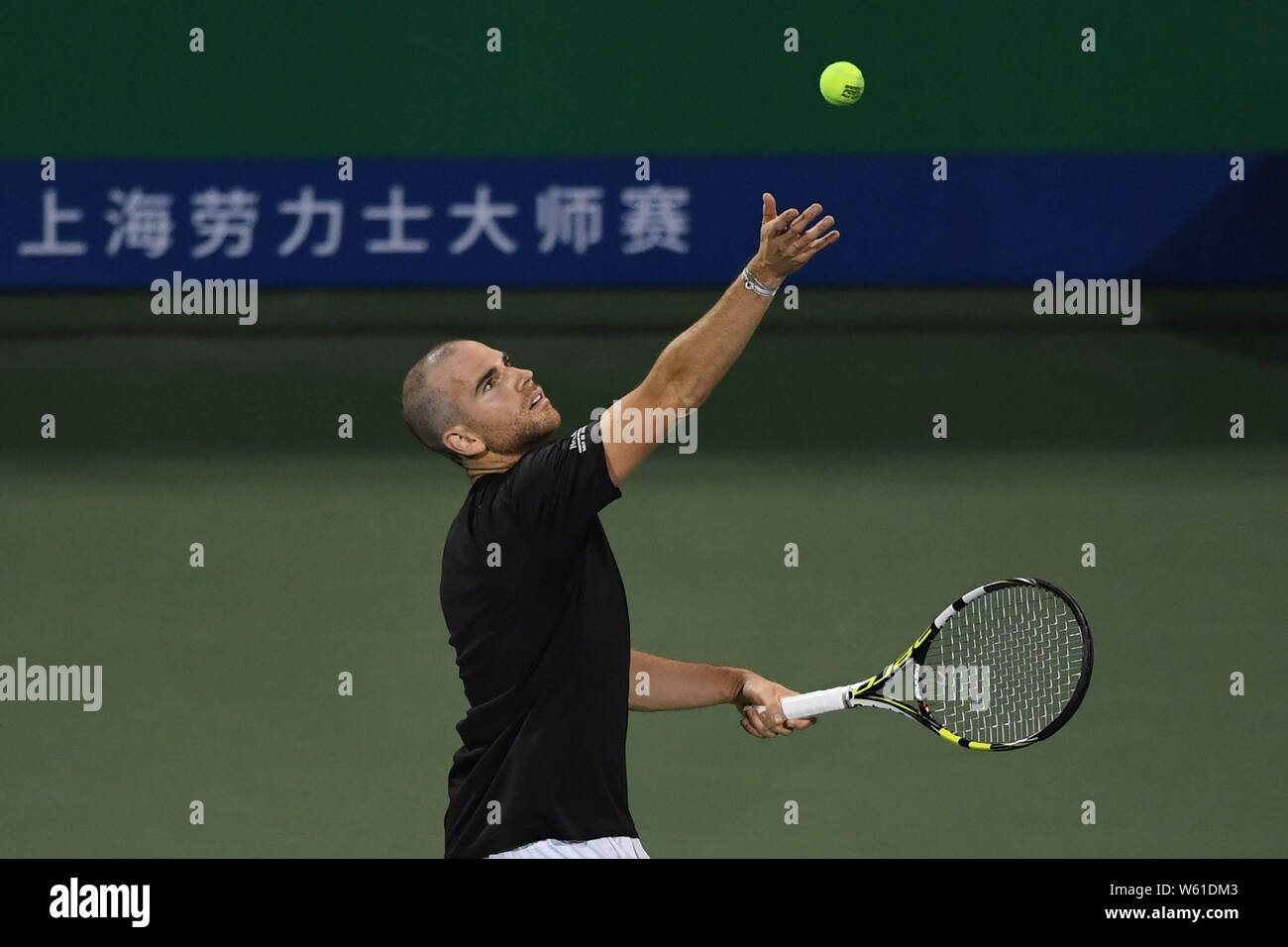 Adrian Mannarino of France serves against Andreas Seppi of Italy in ...