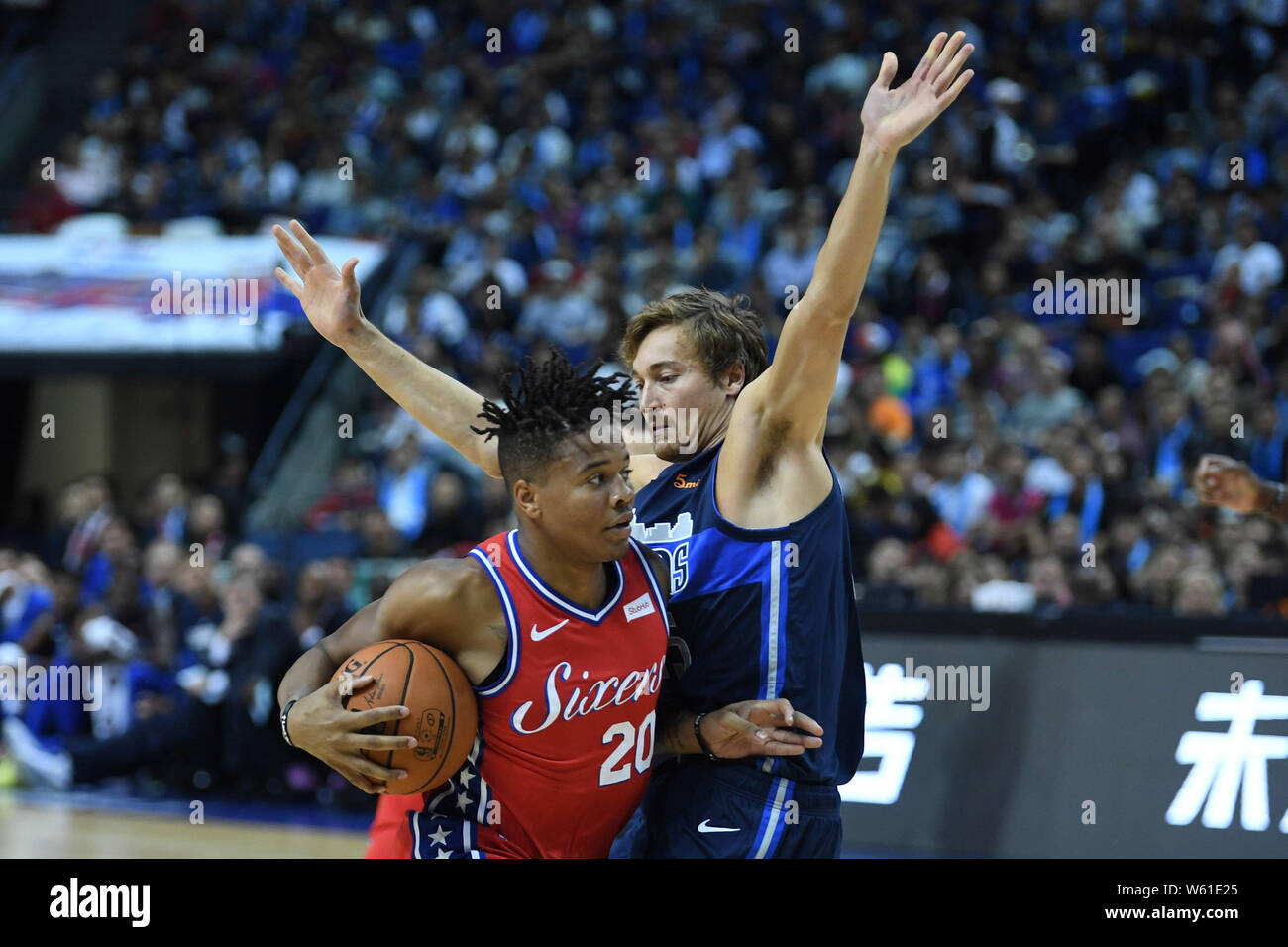 Markelle Fultz of Philadelphia 76ers, left, challenges Ryan Broekhoff ...
