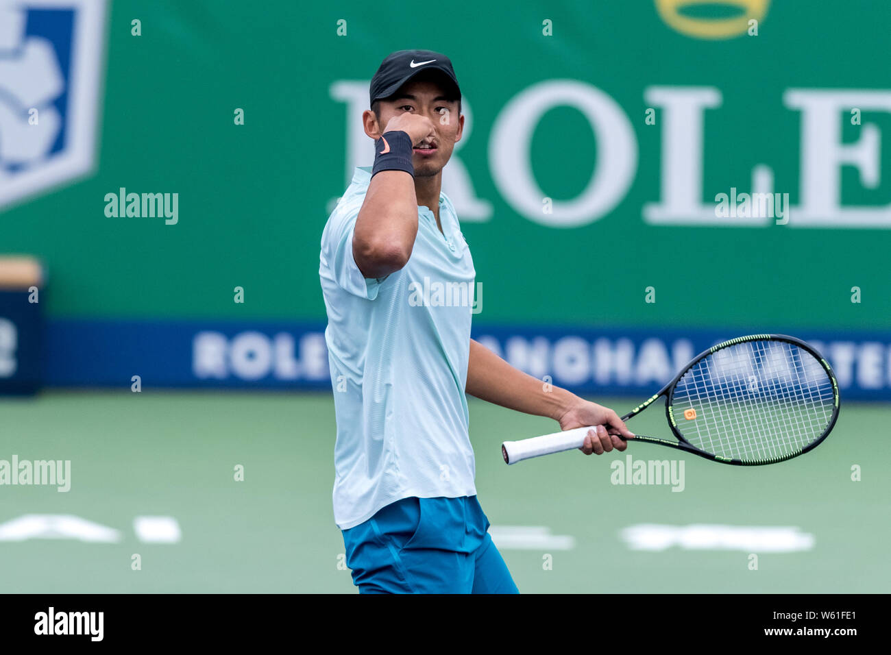 Zhang Ze of China reacts after scoring against Daniil Medvedev of ...
