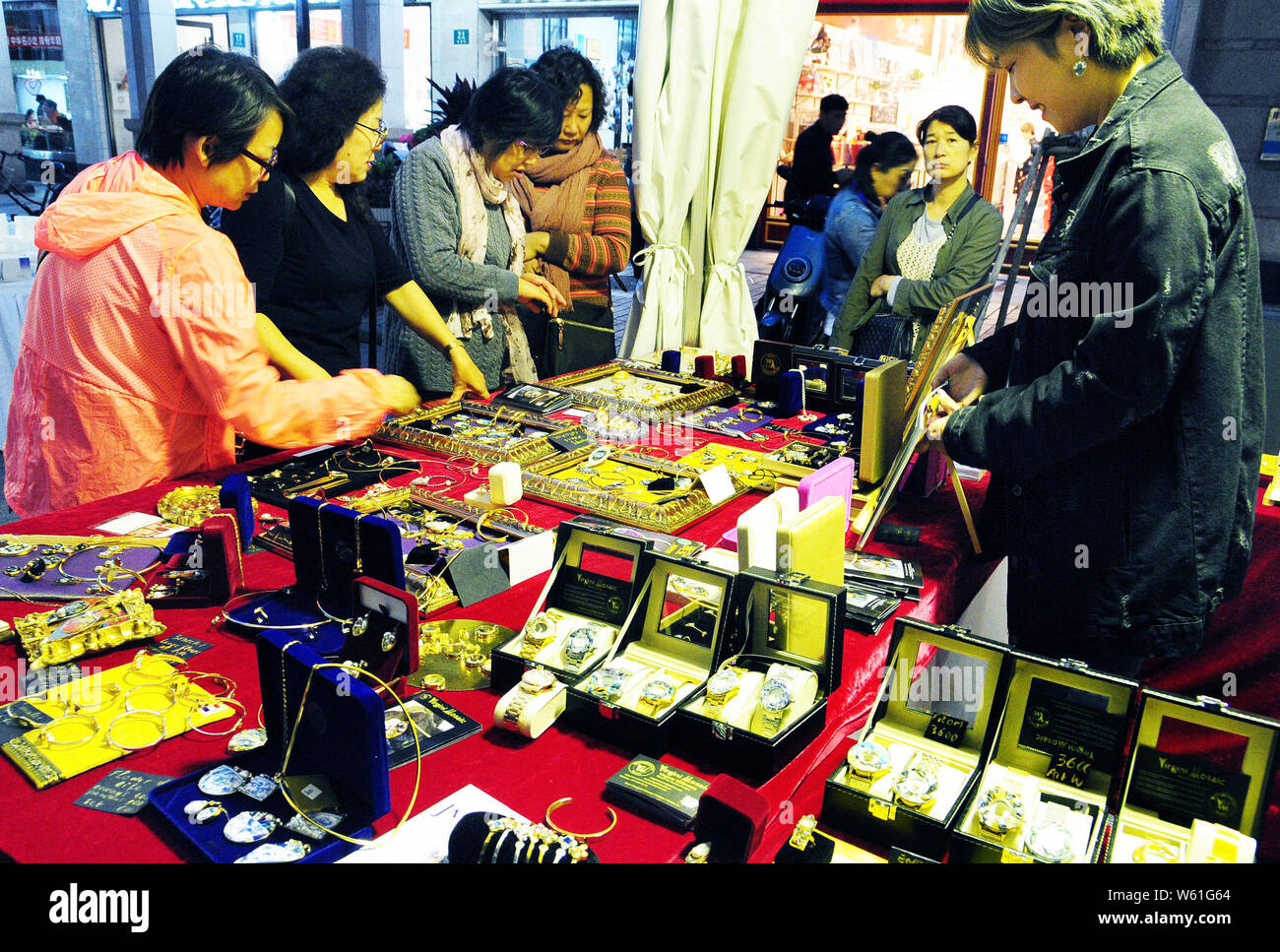 Chinese citizens visit the street market along the Yandang Road during ...
