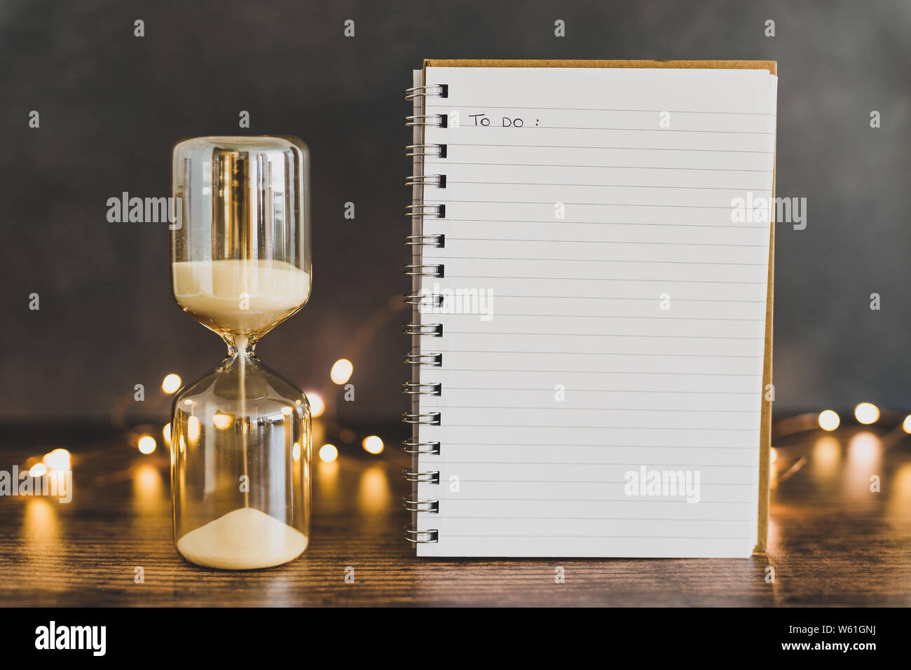 time to get things done conceptual image with hourglass and to do list ...