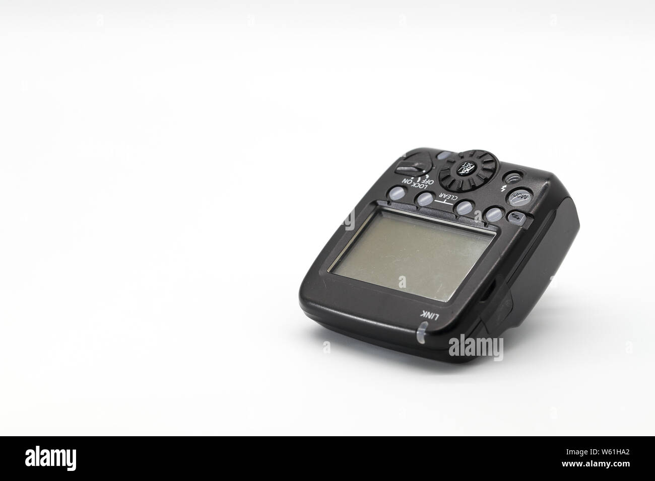 closeup camera flash trigger on isolated background Stock Photo - Alamy
