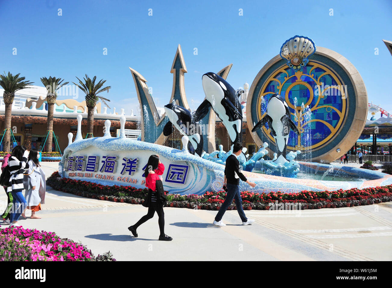 Tourists visit the Haichang Ocean Park during its trial operation in ...