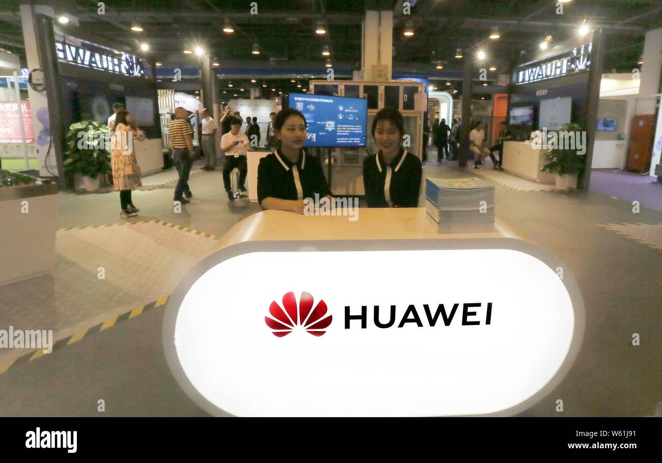 --FILE--People visit the stand of Huawei during an exhibition in ...