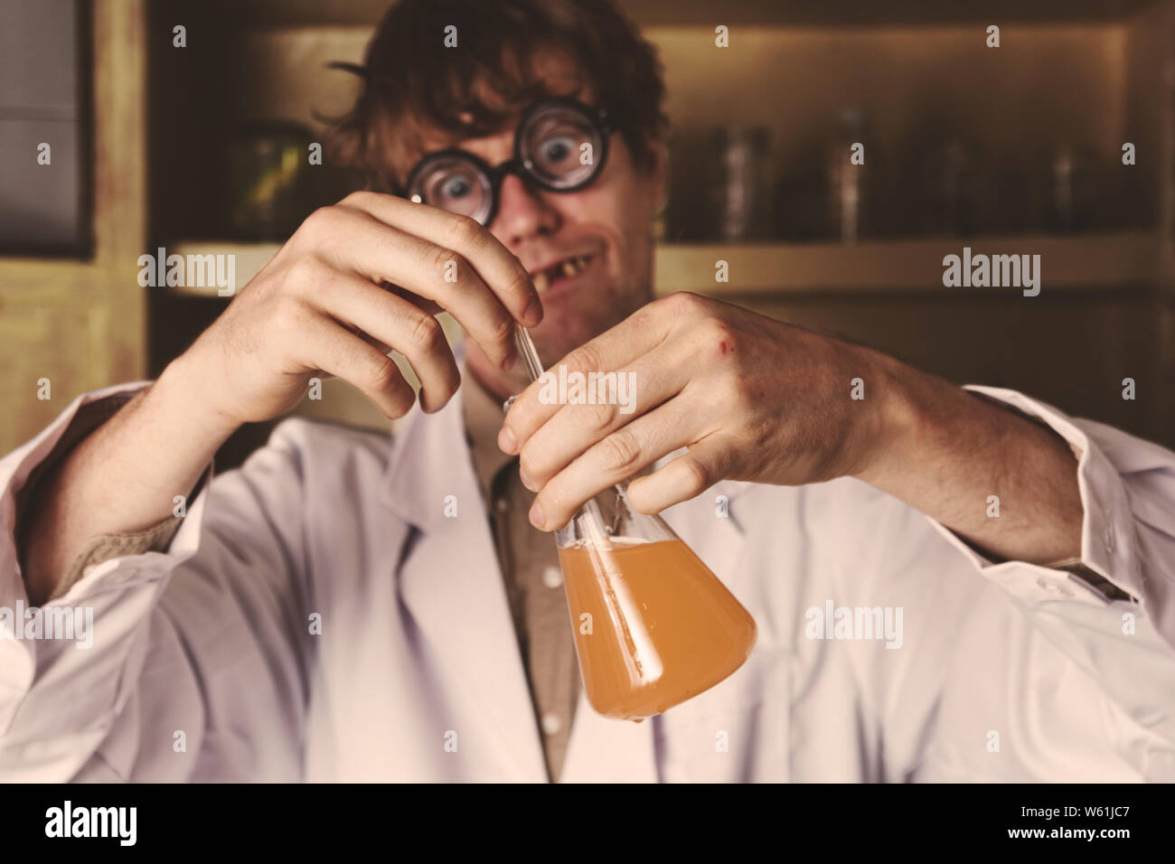 Crazy scientist in his lab doing experiments Stock Photo - Alamy