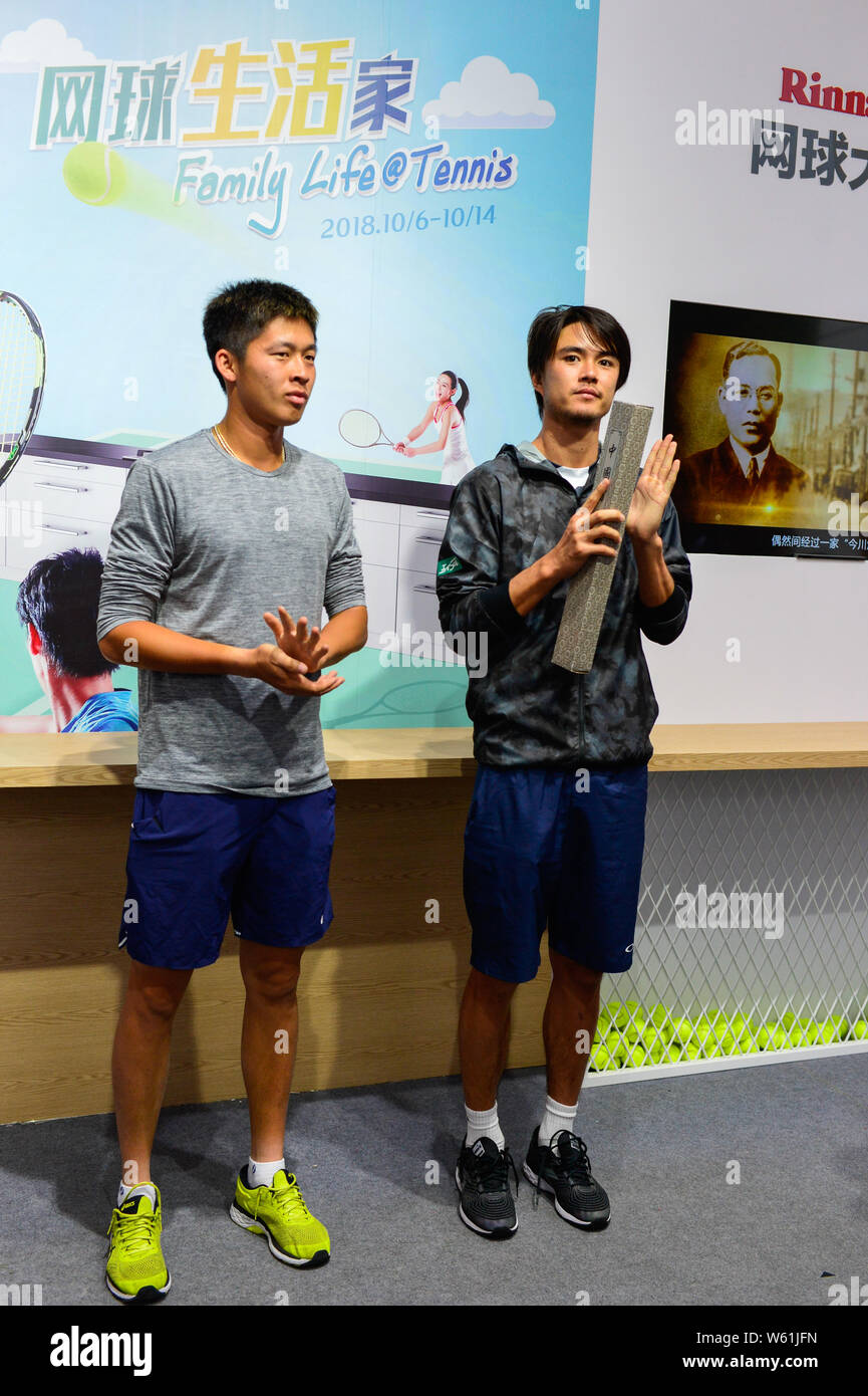 Chinese tennis player Hua Runhao, left, and Japanese tennis player Taro ...