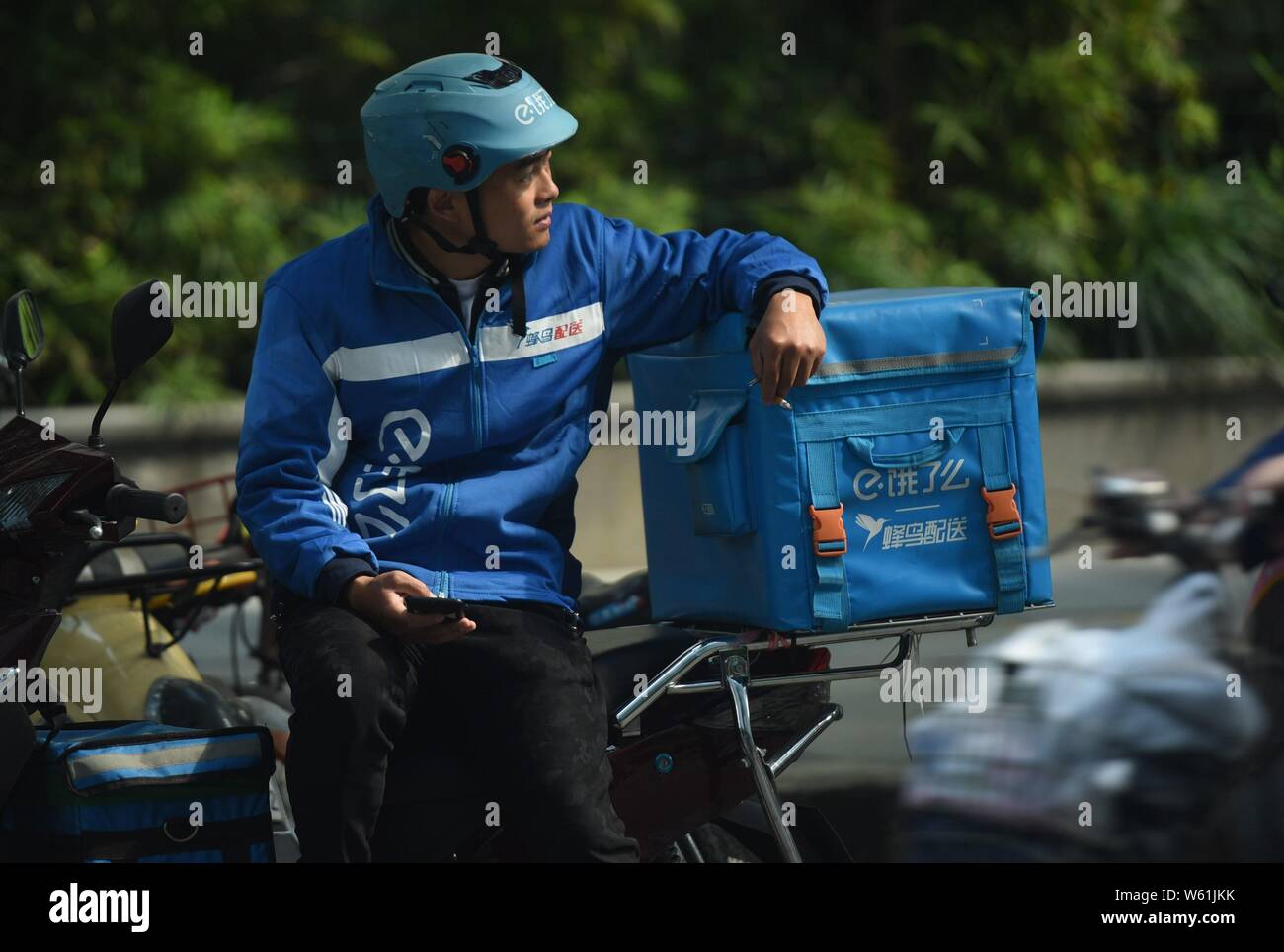 A food delivery courier of Chinese meal delivery company Ele.me backed ...