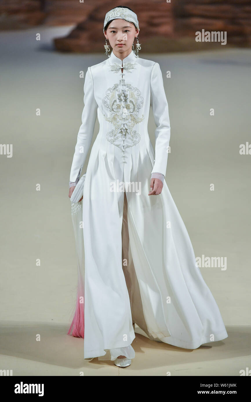 A model displays a new creation at the fashion show of Heaven Gaia by ...