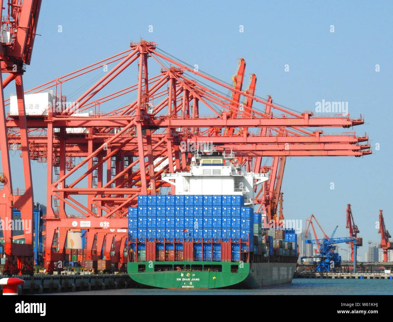 --FILE--A container ship loads containers after berthing at a port in ...