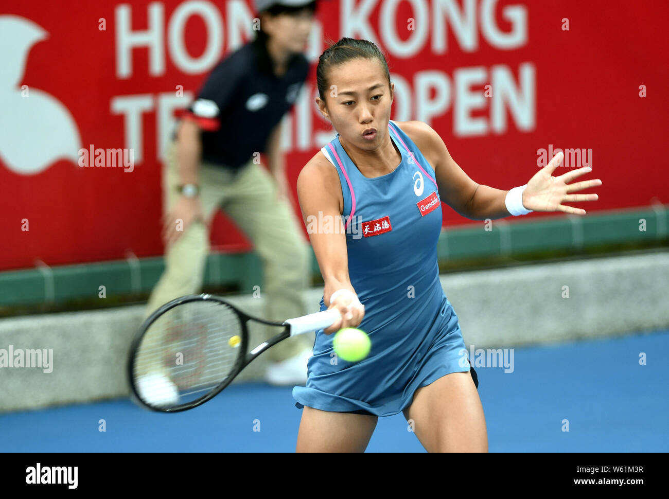 Zhang Shuai of China returns a shot to Lesley Kerkhove of Holland in ...