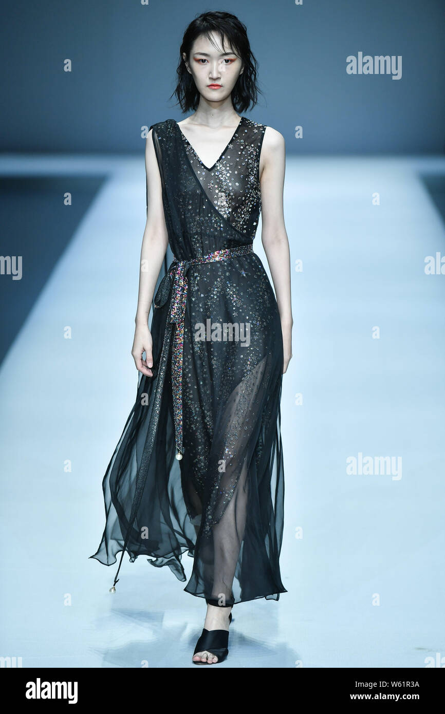 A model displays a new creation at the fashion show of David Sylvia by Hao Weimin during the ...