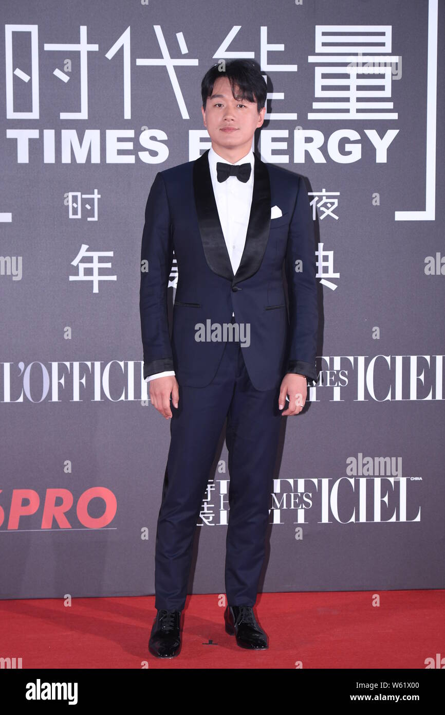 Chinese actor Tong Dawei arrives on the red carpet for the L'Officiel ...
