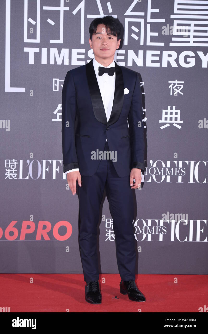 Chinese actor Tong Dawei arrives on the red carpet for the L'Officiel ...