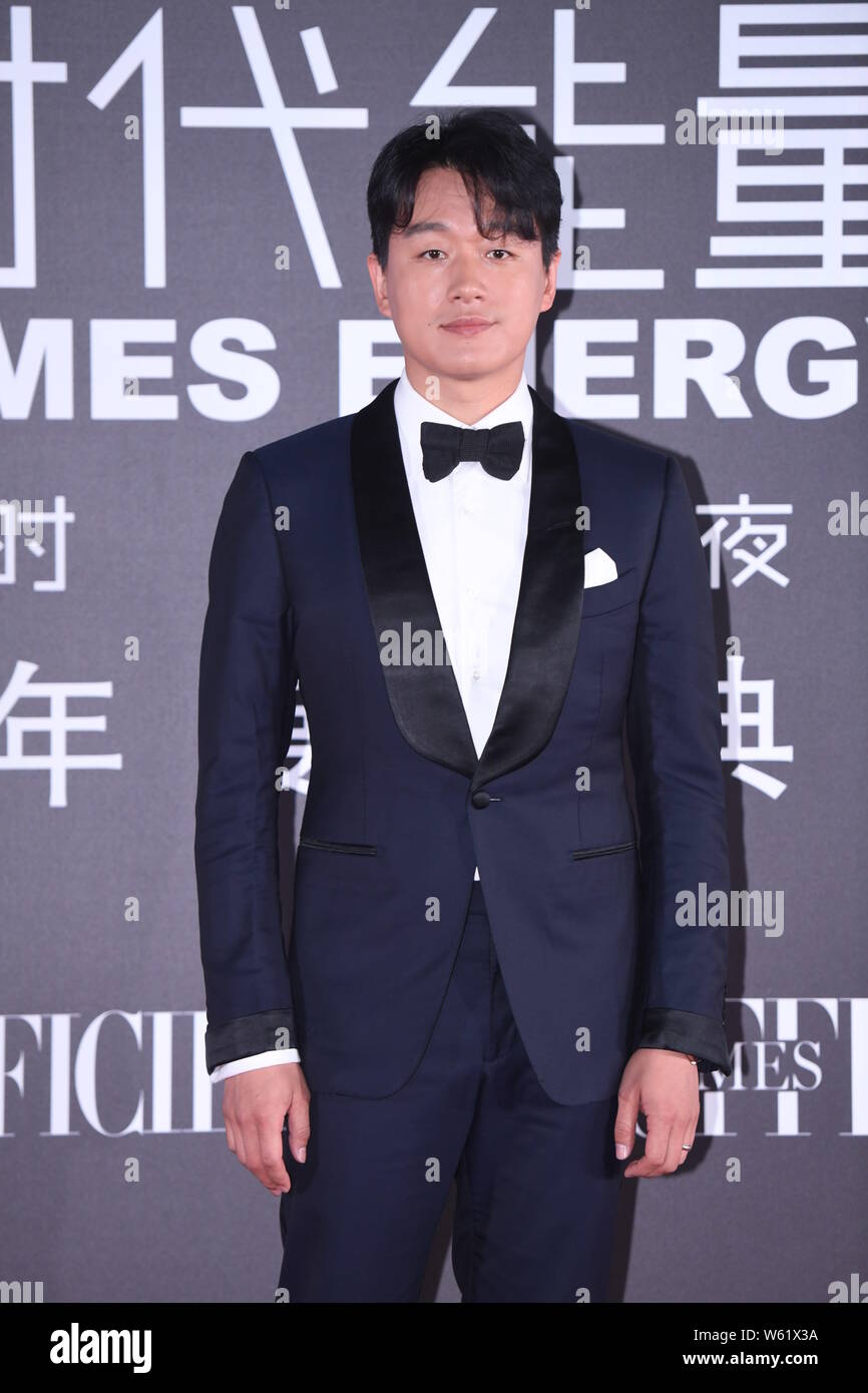 Chinese actor Tong Dawei arrives on the red carpet for the L'Officiel ...