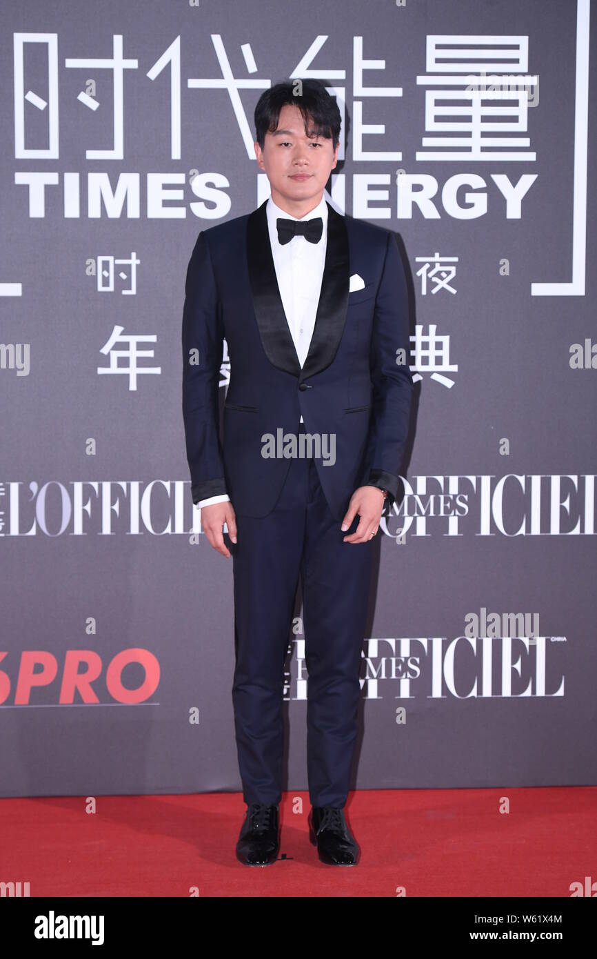 Chinese actor Tong Dawei arrives on the red carpet for the L'Officiel ...