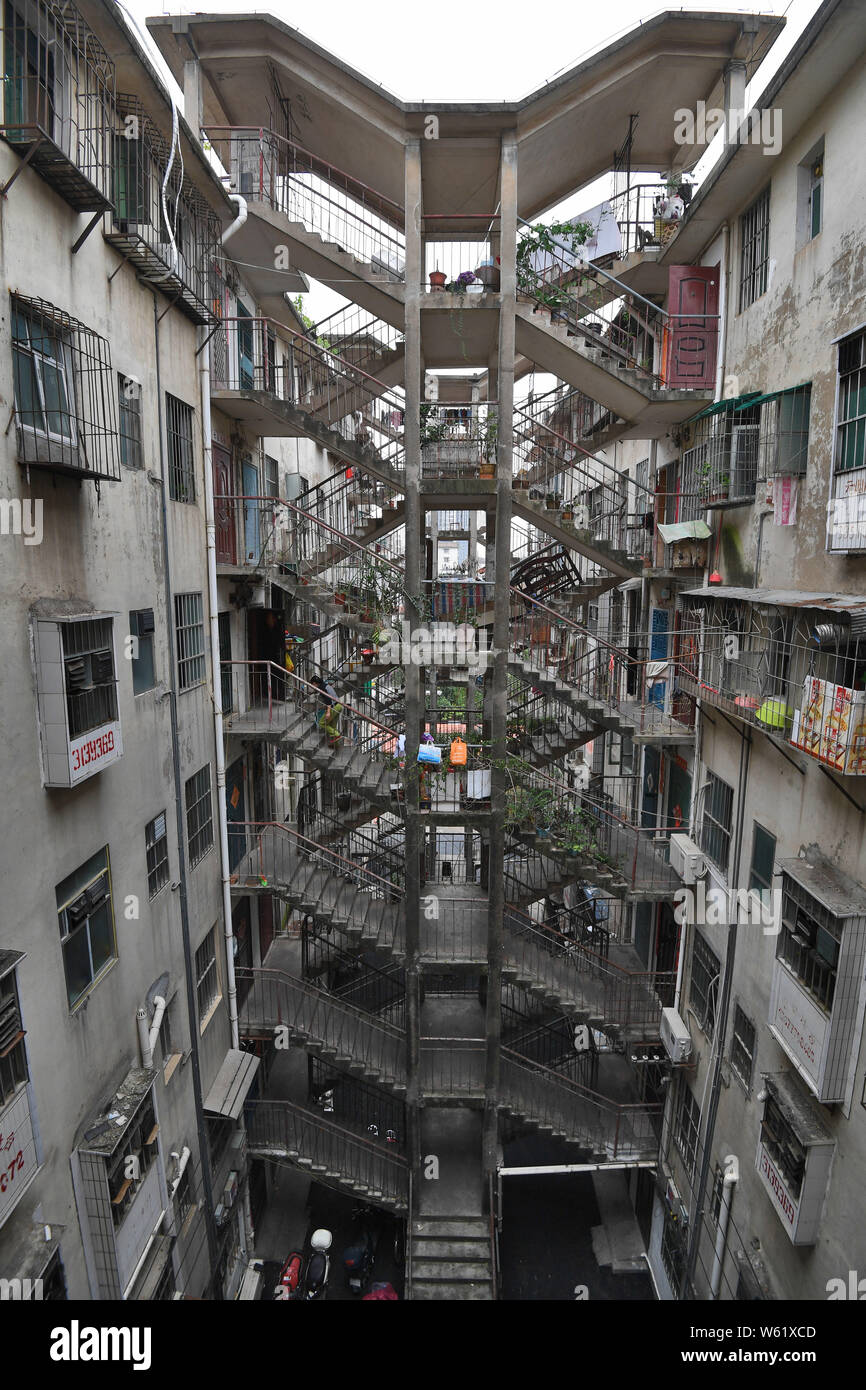 View of a stairwell shared by two residential buildings in a ...
