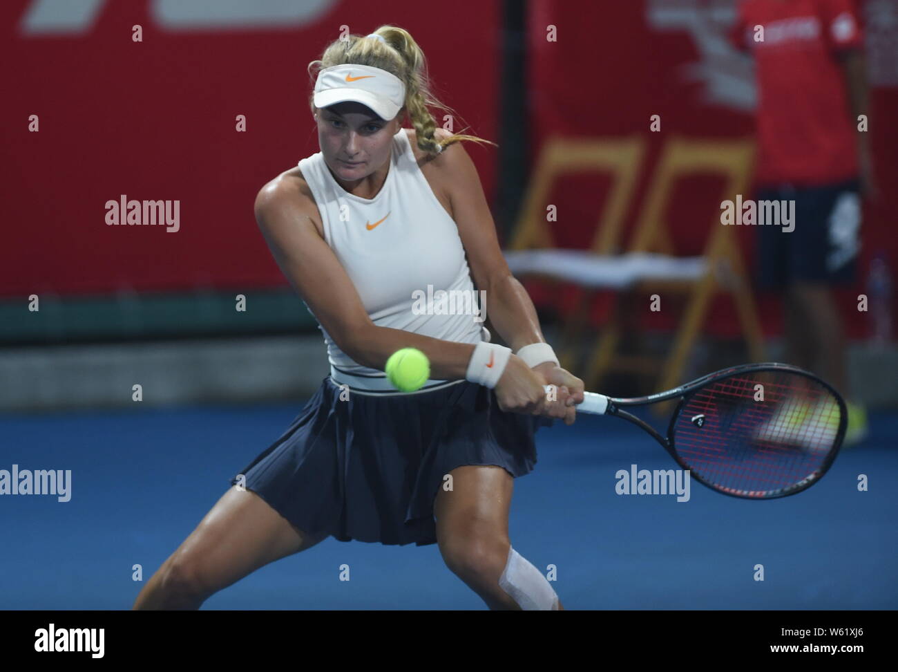 Dayana Yastremska of Ukraine returns a shot to Zheng Saisai of China in ...