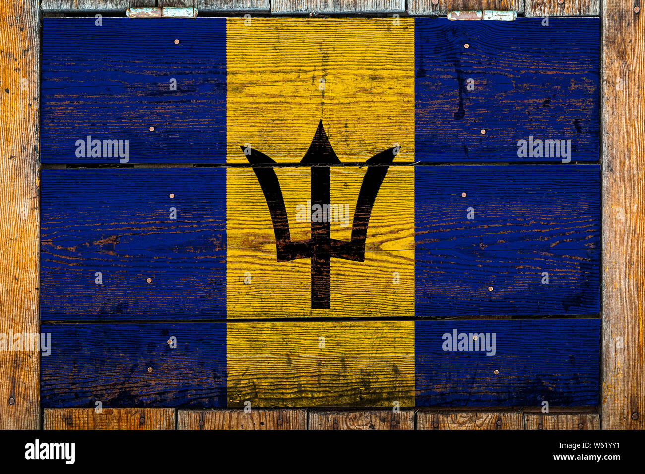 National flag of Barbados on a wooden wall background.The concept of ...