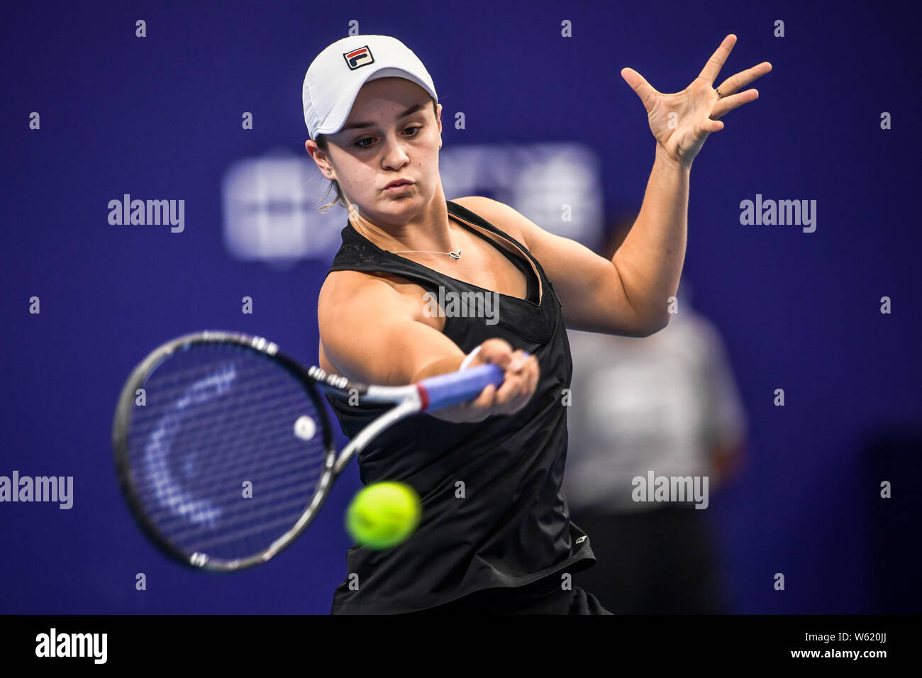 Ashleigh Barty of Australia returns a shot to Aryna Sabalenka of ...