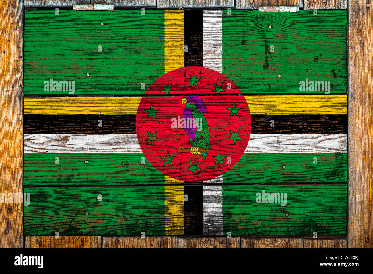 National flag of Dominica on a wooden wall background.The concept of ...