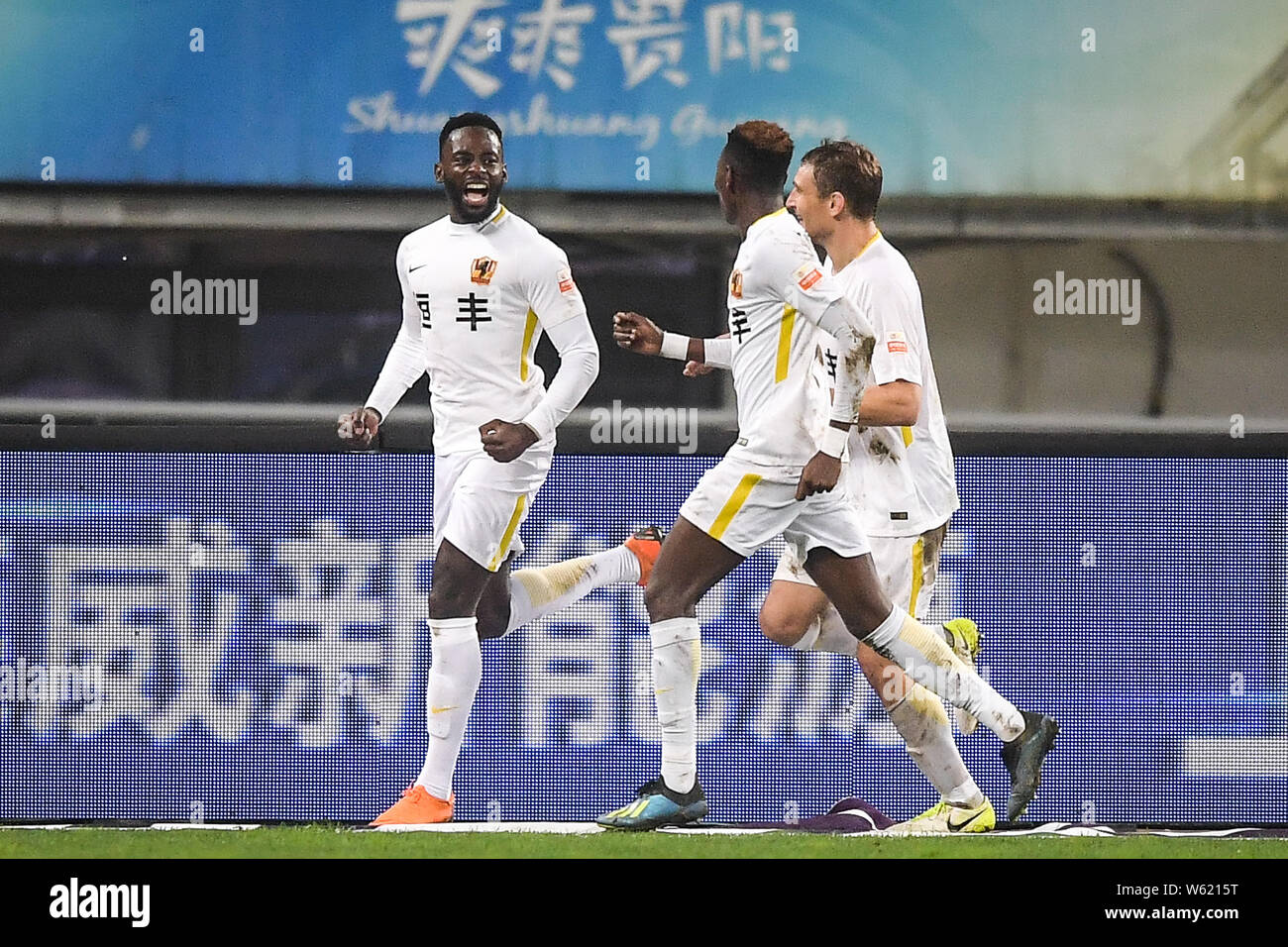 Ivorian football player Kevin Boli, left, of Guizhou Hengfeng ...