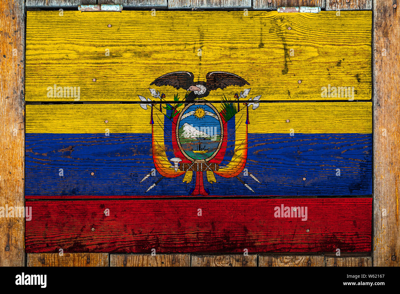 National flag of Ecuador on a wooden wall background.The concept of ...