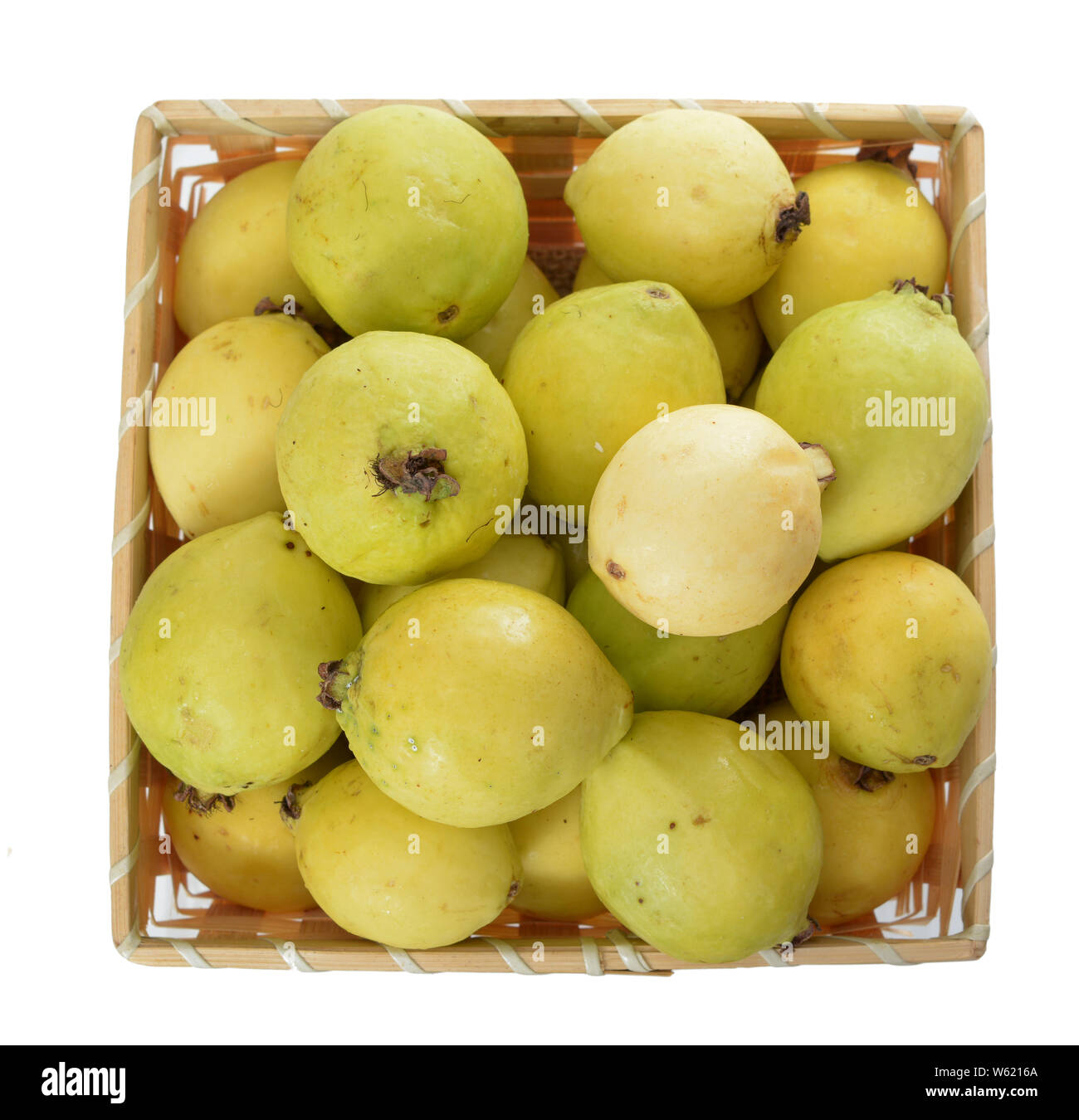 lot of guava in basket isolated on white Stock Photo - Alamy