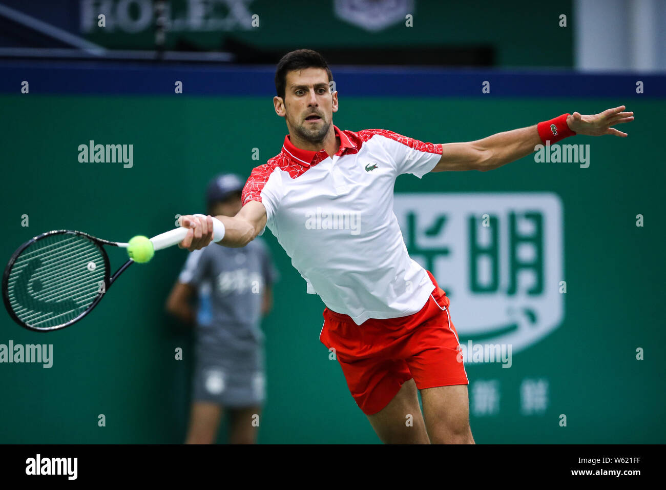 Novak Djokovic of Serbia returns a shot against Borna Coric of Croatia ...