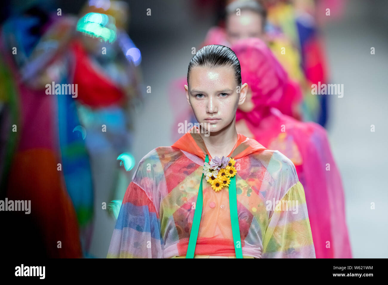 A model displays a new creation at the fashion show of Leaf Xia during ...