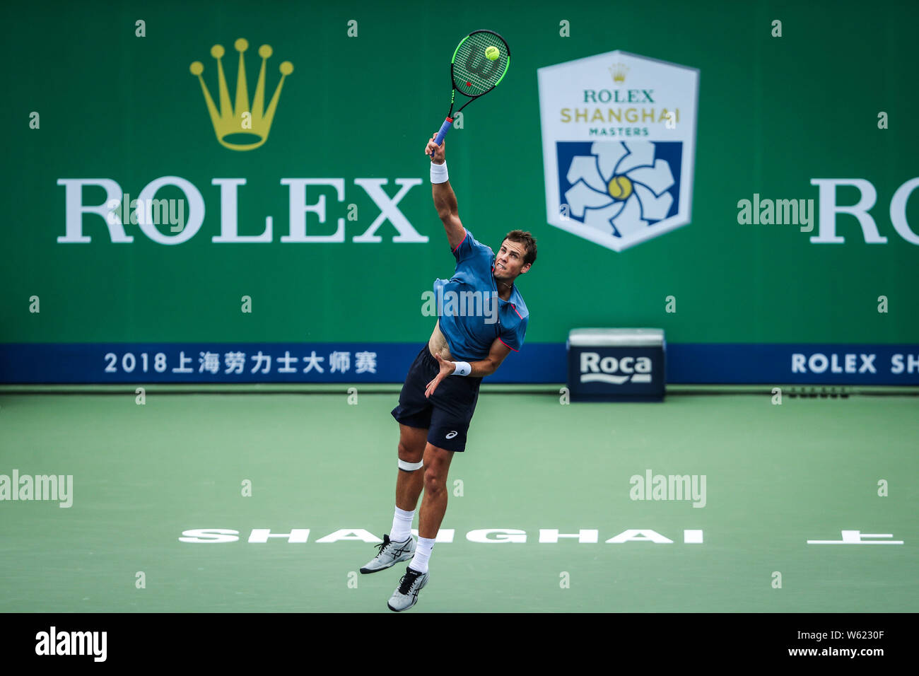 Vasek Pospisil of Canada serves against Alex de Minaur of Australia in ...