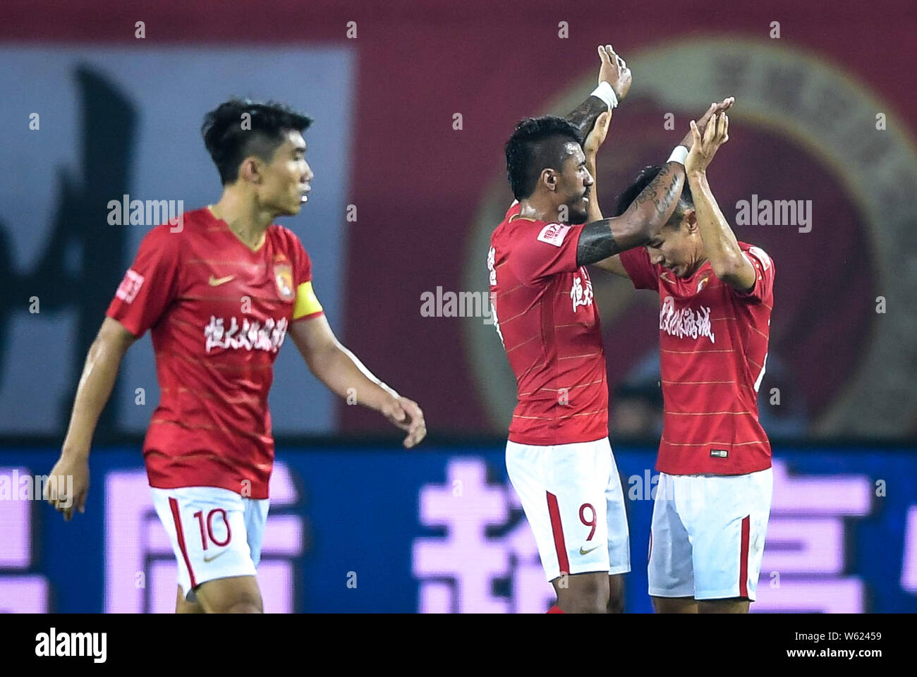 Brazilian football player Paulinho, left, of Guangzhou Evergrande ...