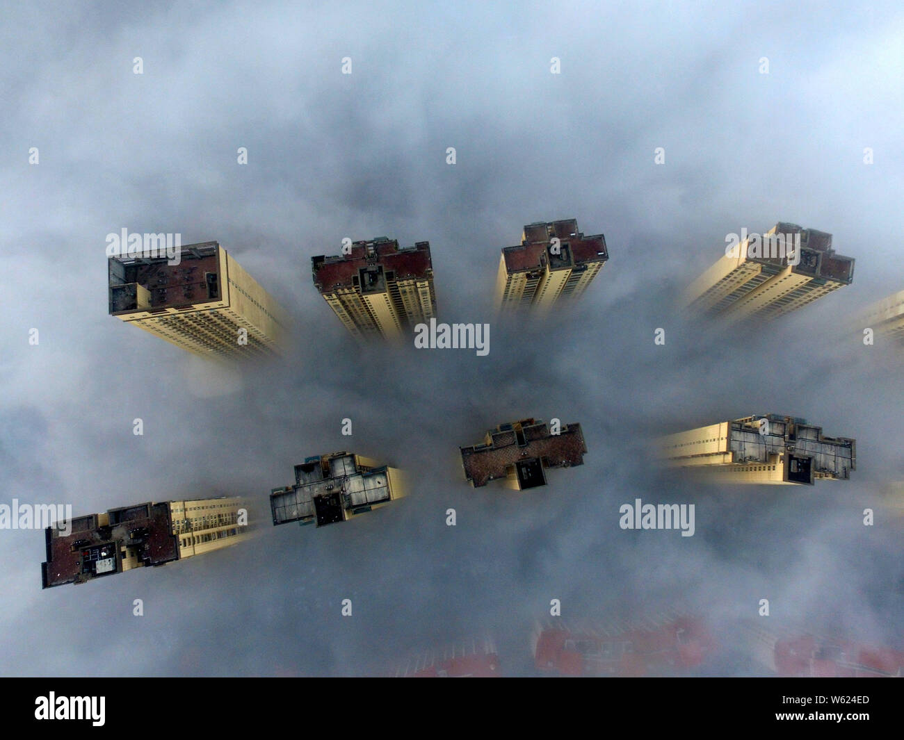 Cityscape of high-rise buildings and skyscrapers shrouded in sea of ...