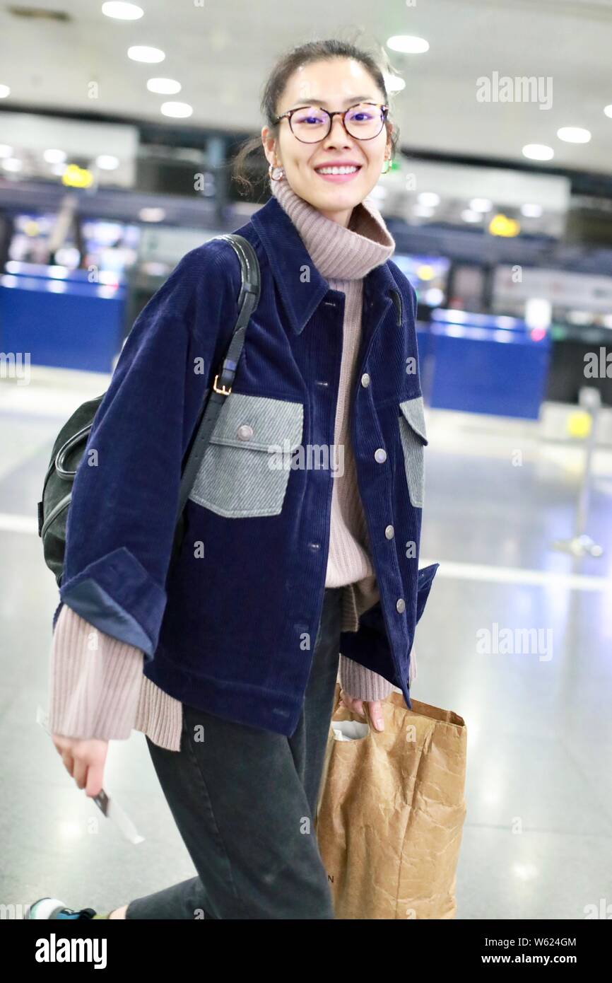 Chinese supermodel Liu Wen arrives at the Beijing Capital International ...