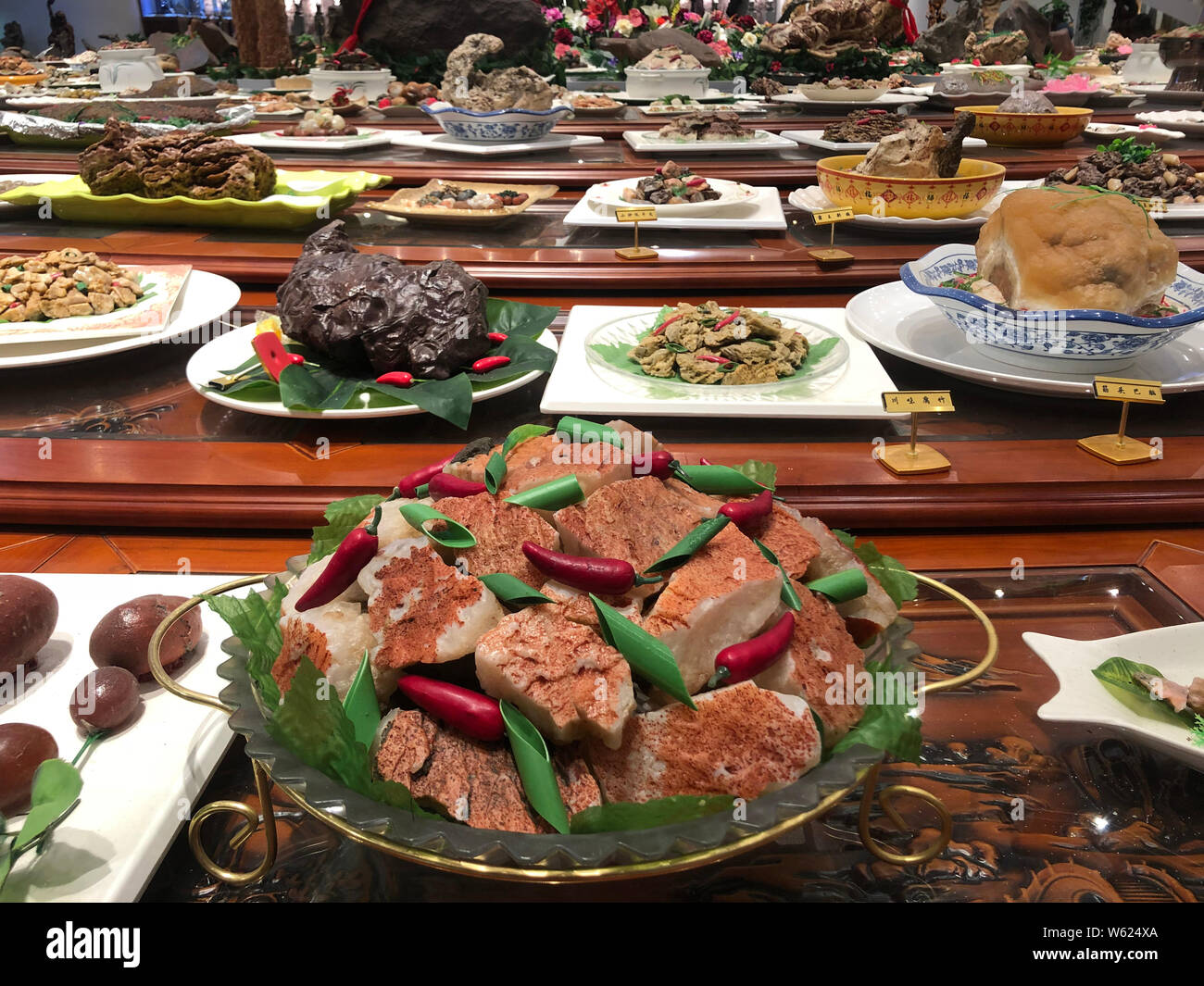 Colorful stones resembling a banquet of dishes are on display at the ...
