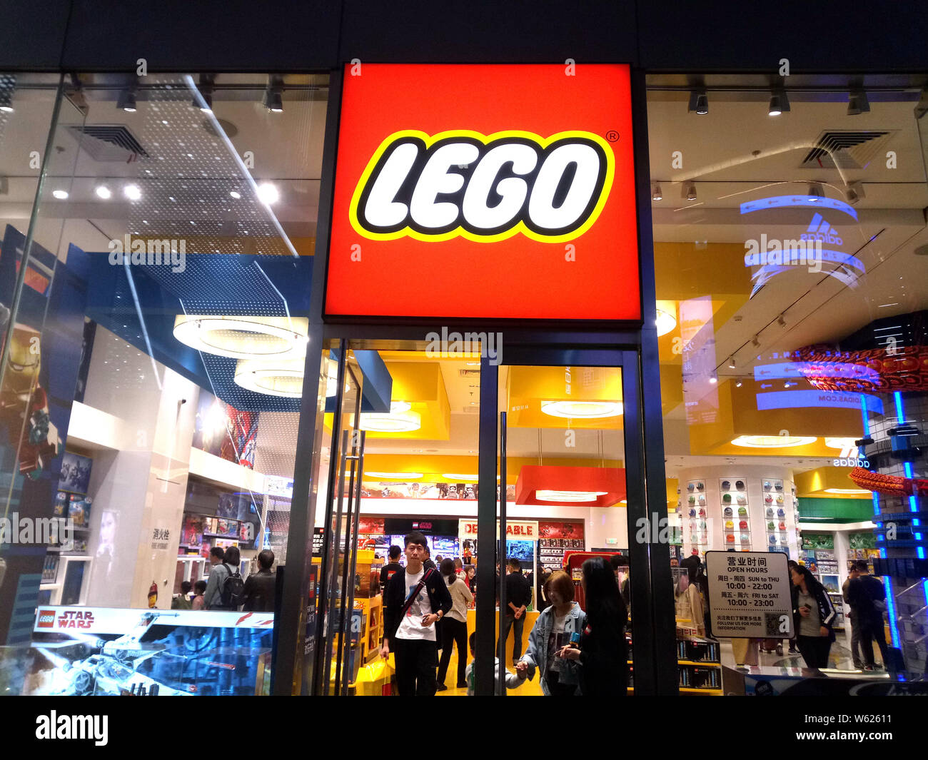 People visit the Lego Flagship store at Shanghai ShiMao Festival City ...