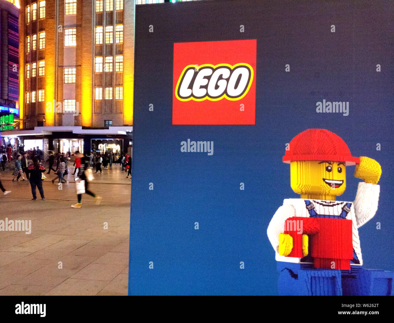 People visit the Lego Flagship store at Shanghai ShiMao Festival City ...