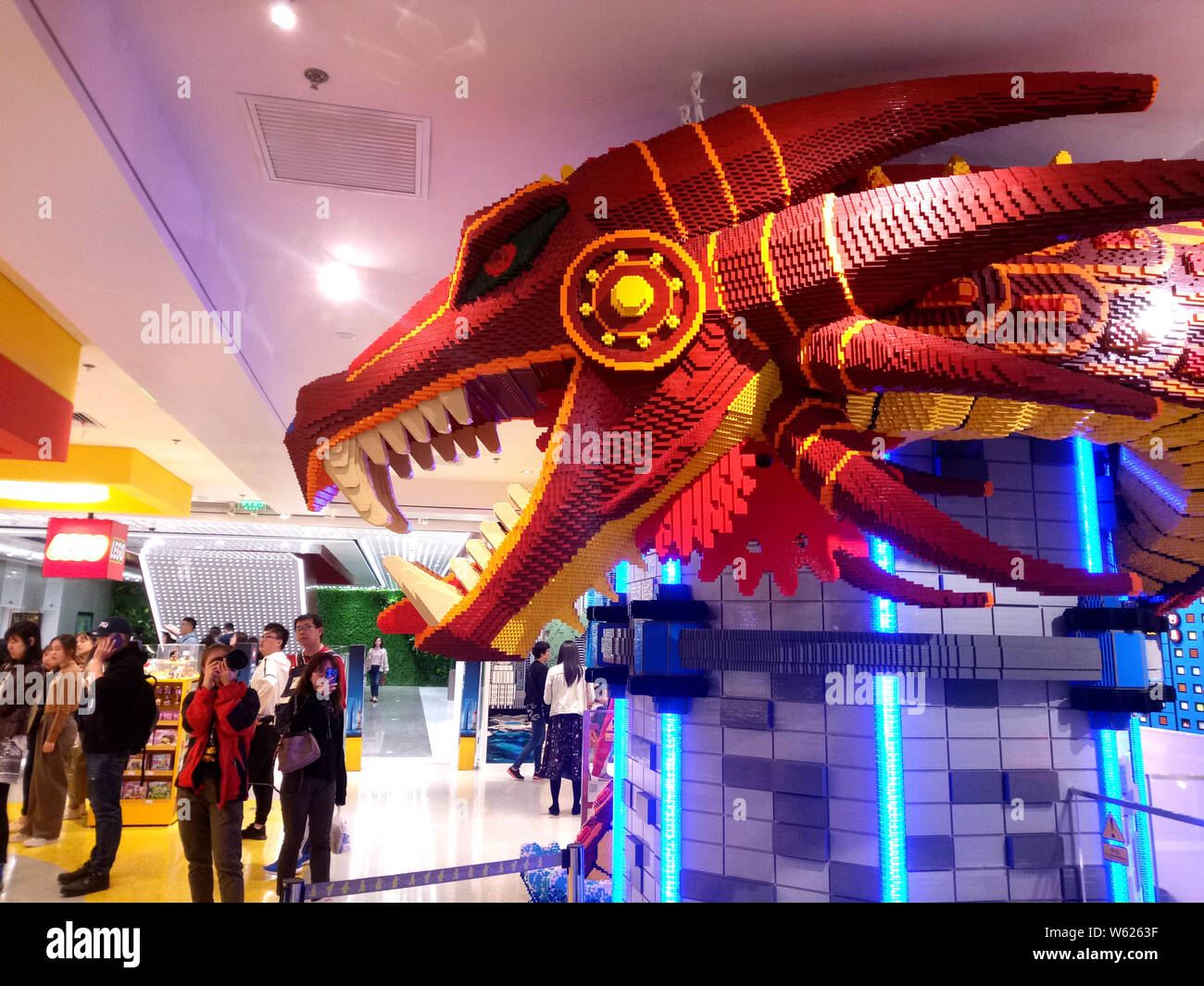 People visit the Lego Flagship store at Shanghai ShiMao Festival City ...